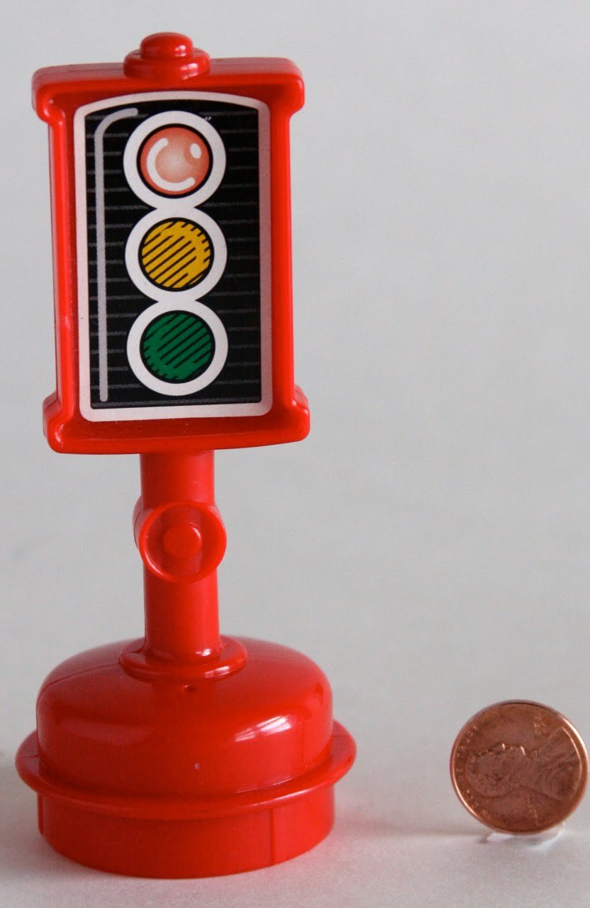 Traffic light toys, old and new, for little kids and big.